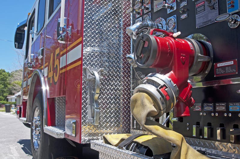 Side view of a firetruck editorial stock photo. Image of flame - 24065603