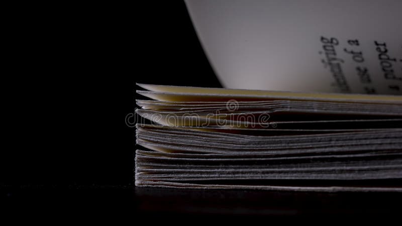Side View of the Flipping Pages of a Thick Book with English Text. Book ...