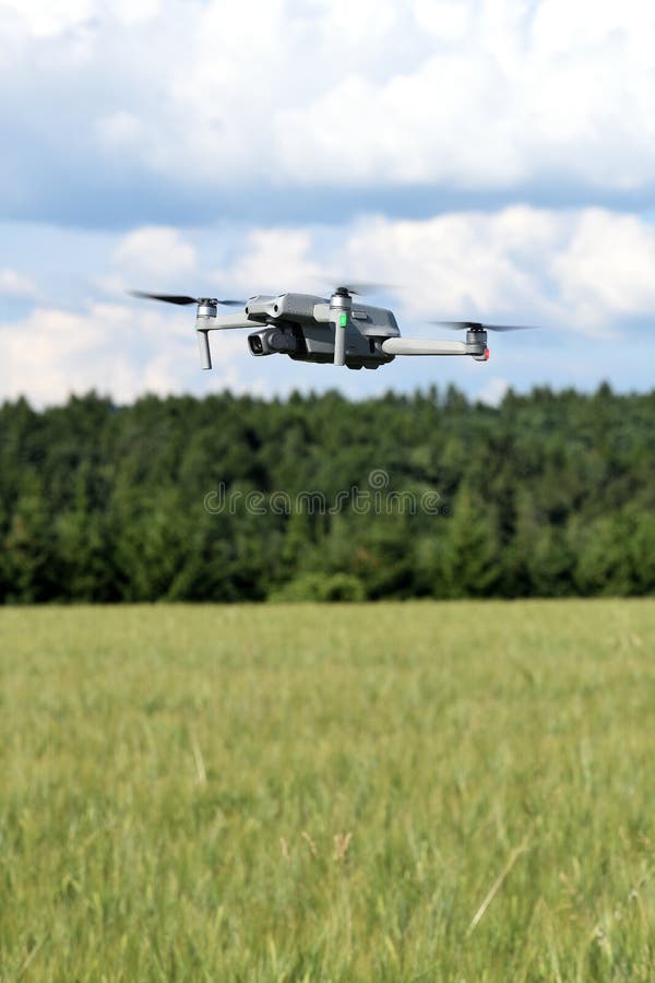 Side View of a Flying Modern UAV Drone on Yellow Corn Field Stock Photo ...