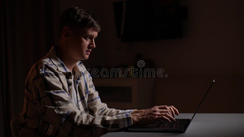 Side View of Focused Busy Young Man Working Browsing on Laptop Computer ...