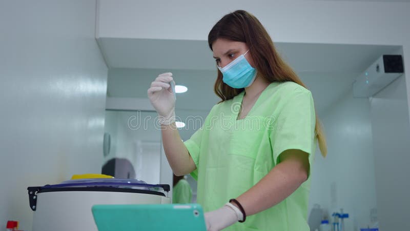 Side View Focused Smart Laboratory Assistant Checking Test Tube ...