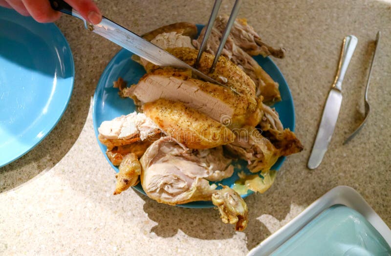 Side View of a Freshly Roasted Chicken Being Carved Stock Photo - Image ...