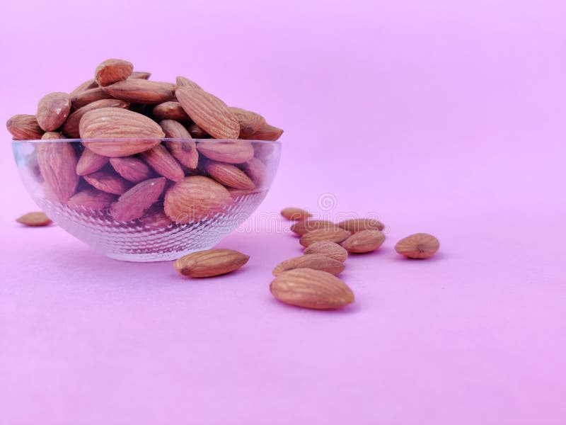 Side View of a Glass Bowl Full of Almonds. Stock Photo - Image of ...