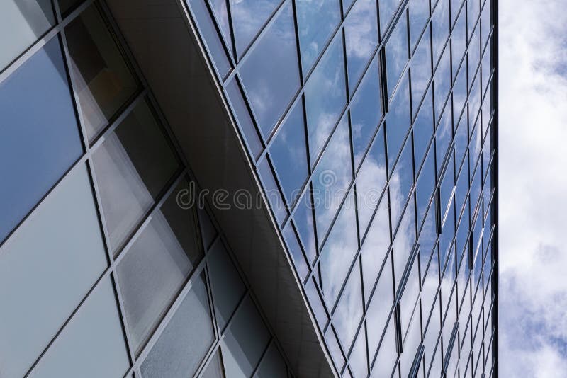 Side View of Glass Surface on Modern Building Facade with Reflected Sky ...