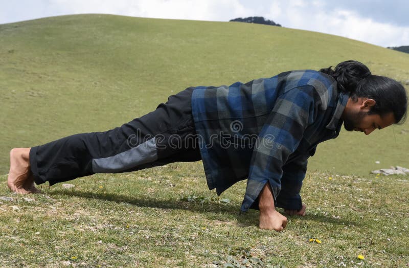 Side View of a Good Looking Indian Young Man Doing Fist Push-ups in the ...