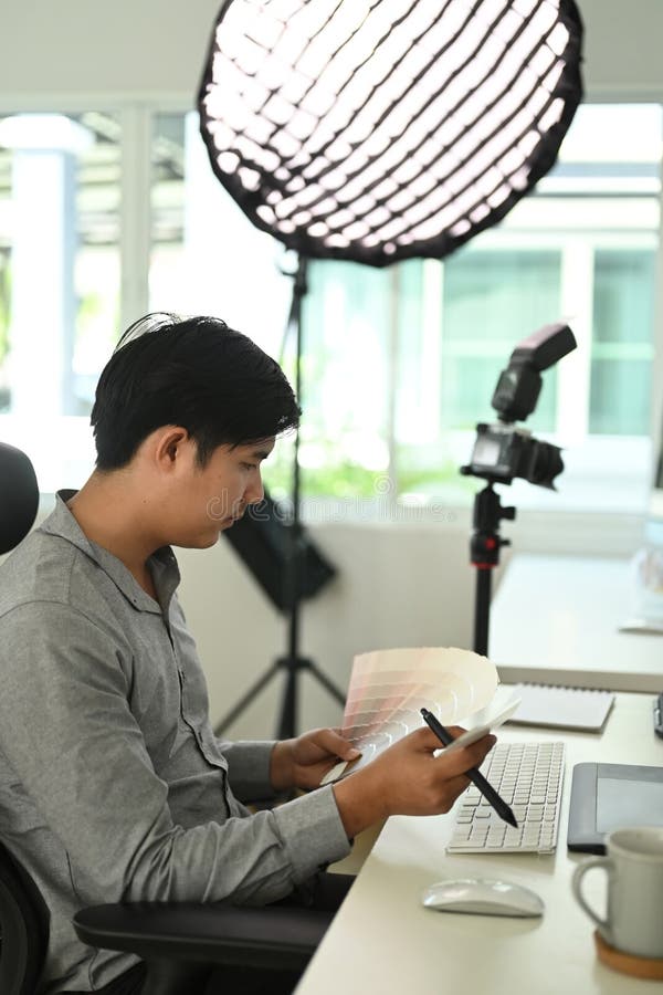 Side View of Graphic Designer or Photographer is Working with Color ...