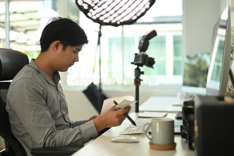 Side View of Graphic Designer or Photographer is Working on Color ...