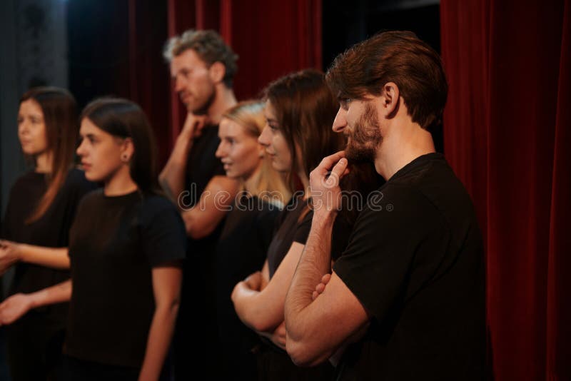 Side View. Group of Actors in Dark Colored Clothes on Rehearsal in the ...