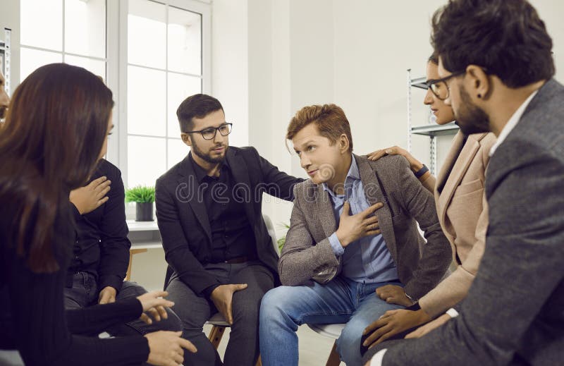 Side View on Group of Gathered People, Comforting Their Comrade by ...