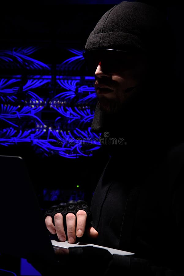 Side View of Hacker in Eyeglasses Using Laptop with Cables Stock Image ...