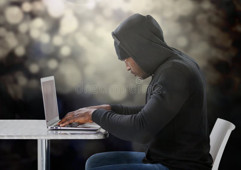 Side View of Hacker Using a Laptop on a Table Stock Photo - Image of ...