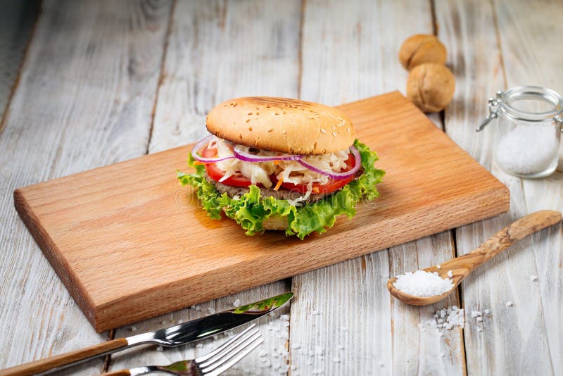 Side View on Hamburger with Sauerkraut and Lettuce Stock Photo - Image ...
