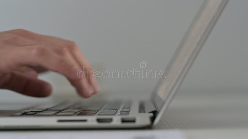 Side View of Businessman Using Mouse and Typing on Desktop Keyboard ...