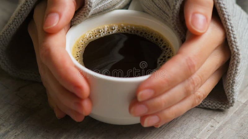 Side View of Hands with Cup of Black Coffe on Light Wooden Table ...