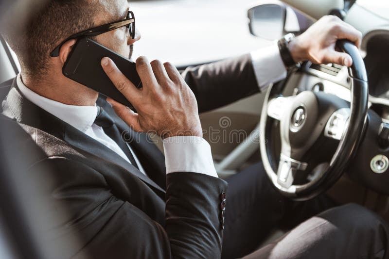 Side View of Handsome Driver in Suit Driving Car and Talking Stock ...