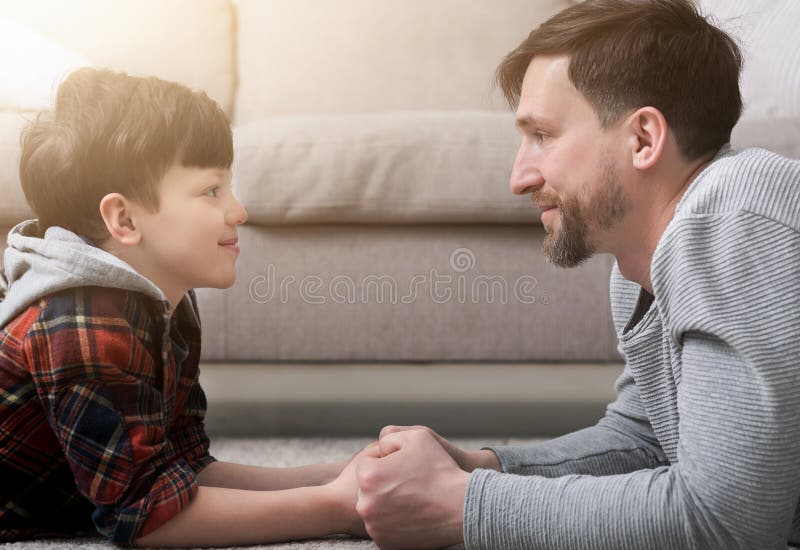 Side View of Handsome Father and Son Looking at Each Other Stock Image ...