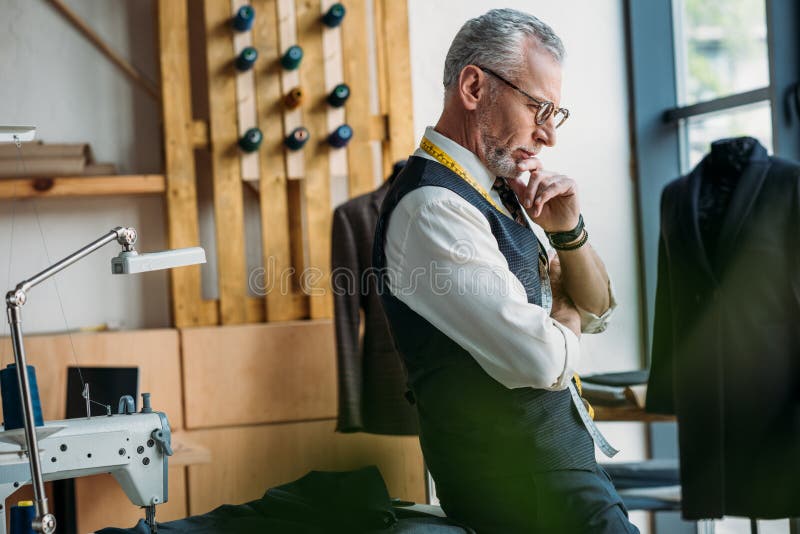 Side View of Handsome Pensive Tailor Standing Stock Image - Image of ...
