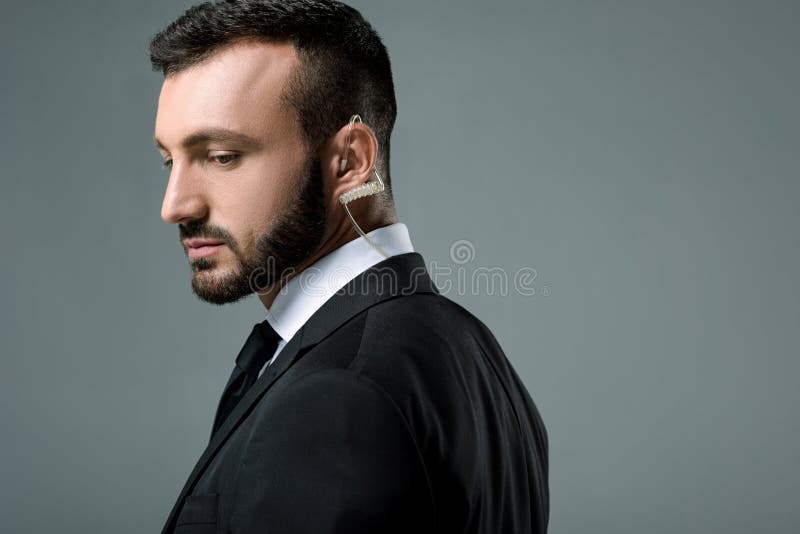 Side View of Handsome Security Guard with Security Earpiece Stock Image ...