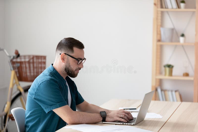 Side View Handsome Young Businessman Typing on Keyboard Using Laptop ...