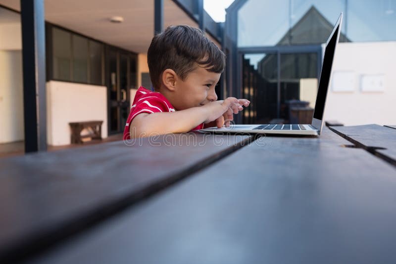 Side View of Happy Boy Using Digital Laptop Stock Image - Image of ...