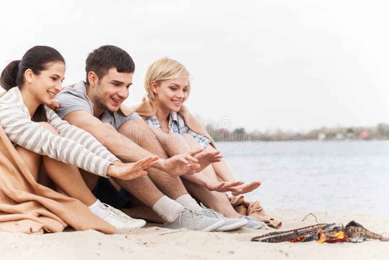 Side View of Happy Friends Having Fun Around Bonfire. Stock Image ...
