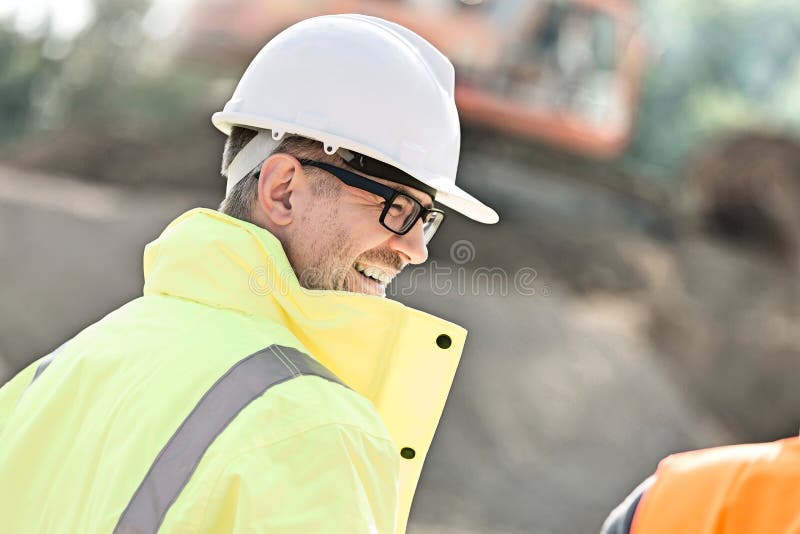 Male Supervisor Looking At Camera While Checking Stocks In Warehouse ...