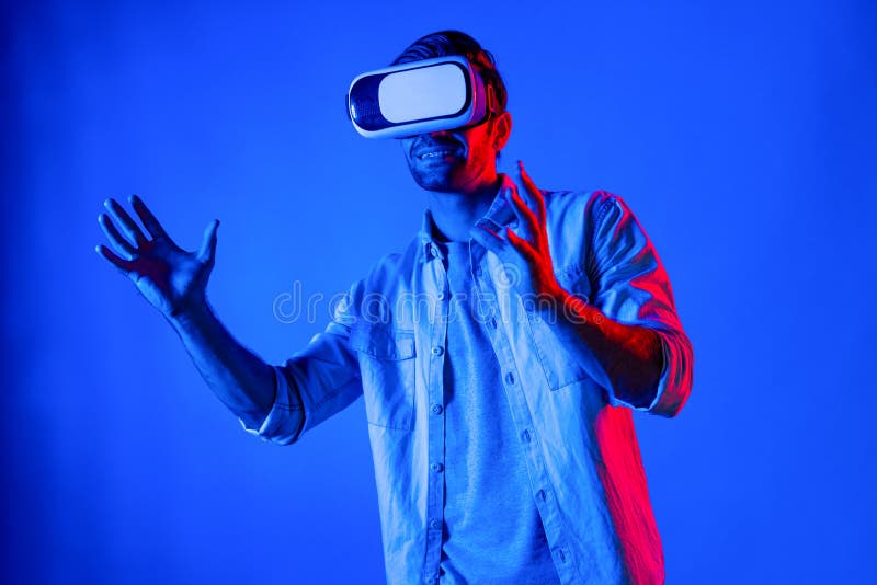 Side View of Man Holding and Moving Gesture while Using VR Goggle ...