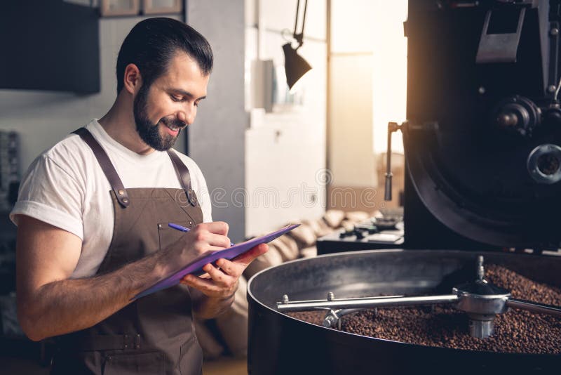 Smiling Worker Writing Information about Roasting Beans Stock Image ...