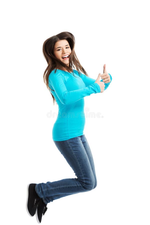 Side View Happy Woman Jumping with Thumbs Up Stock Photo - Image of ...
