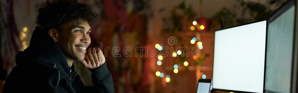 Side View of Happy Young Guy with Piercing Sitting at the Table in ...