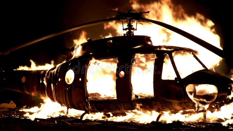 Side View of a Helicopter Completely Engulfed in Intense Flames at ...