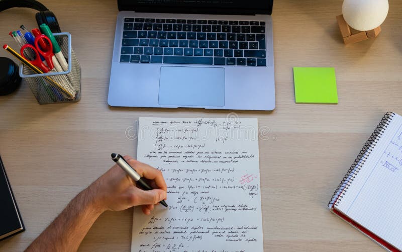 Side View of High School or College Student Studying and Writing in a ...