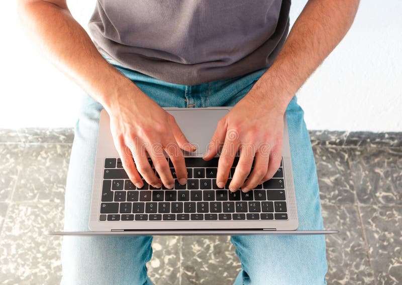 Side View of High School or College Student Studying and Writing in a ...