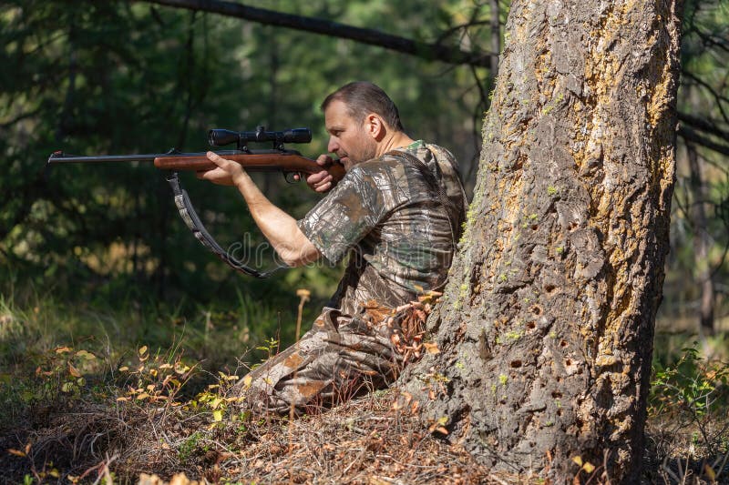Side View of Hunter in Camouflage Shooting Rifle Stock Photo - Image of ...