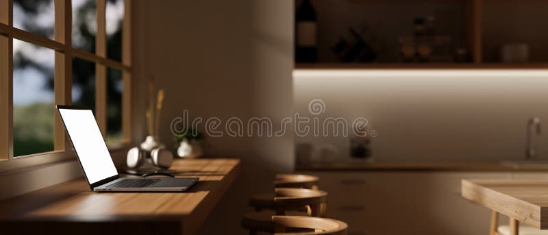 Side View Image of a Laptop on a Hardwood Desk Against the Window in a ...