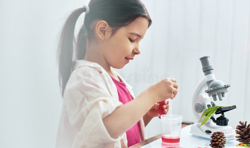 Side View Image of Scientific Little Girl Working with Microscope and ...