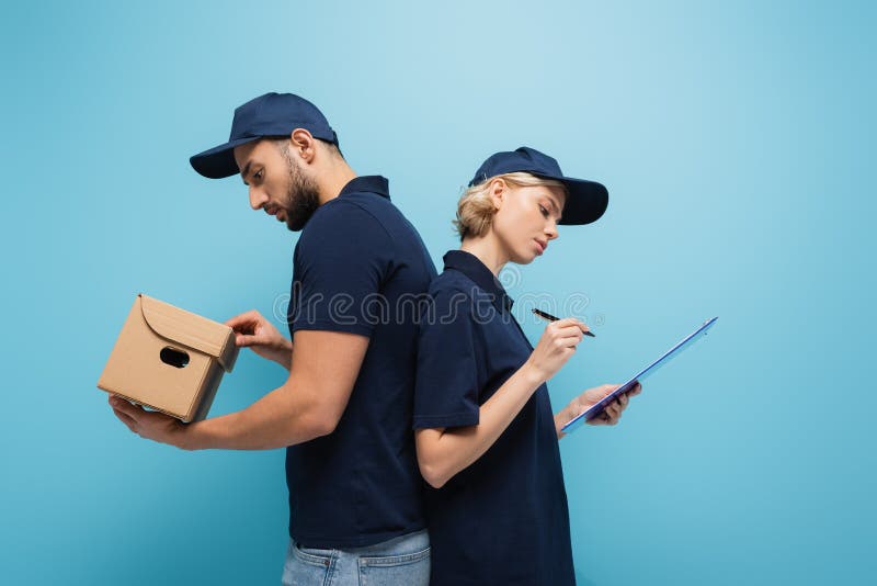 Side View of Interracial Couriers with Stock Photo - Image of clipboard ...
