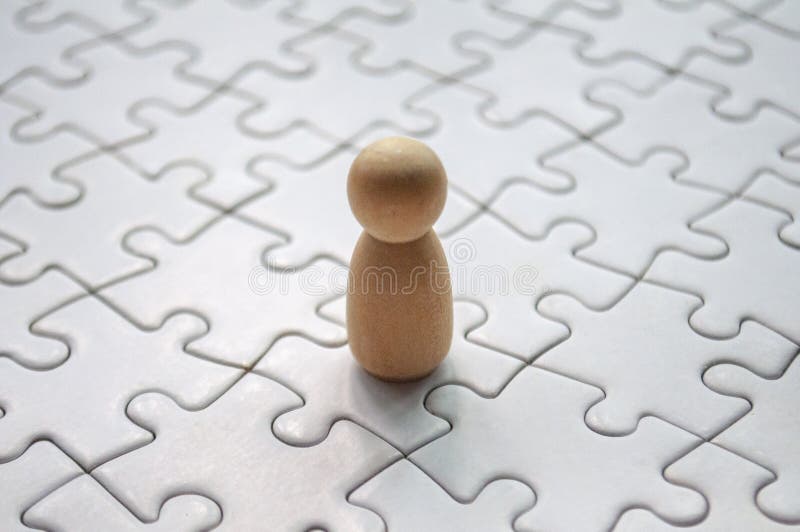 Side View of Isolated Wooden Figure on Jigsaw Puzzle Stock Photo ...