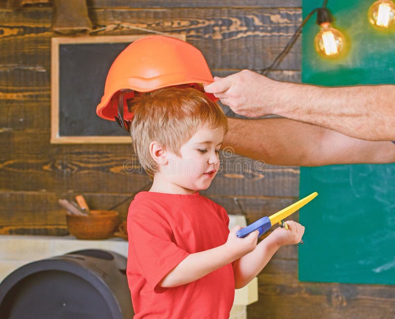 Side View Kid Talking To His Daddy in Workshop. Boy Asking Question ...