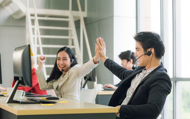 Side View of Line of Call Center Employees are Smiling and Working on ...