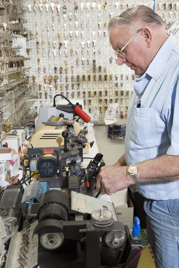 Side View of Locksmith Working in Key Store Stock Image - Image of ...