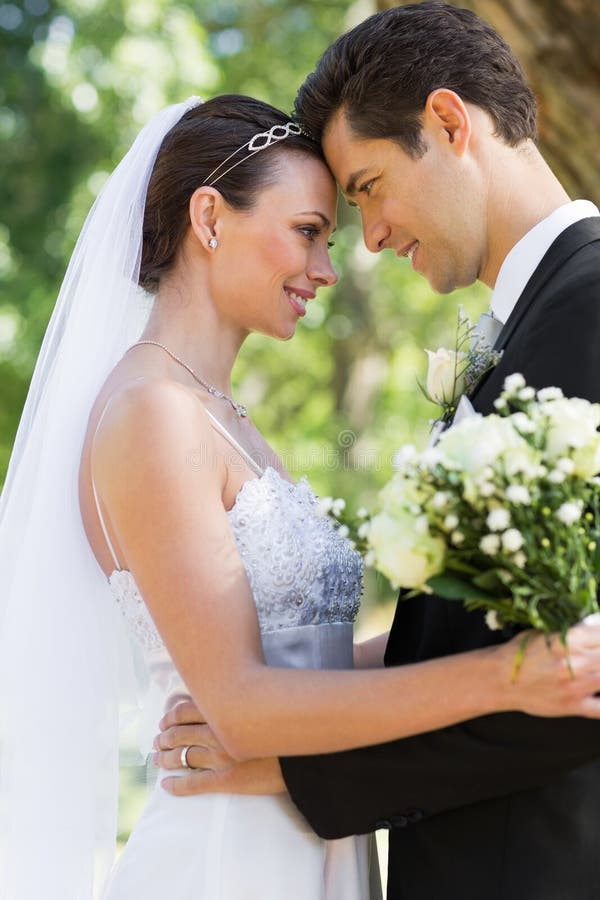 Side View of Loving Bride and Groom in Garden Stock Image - Image of ...