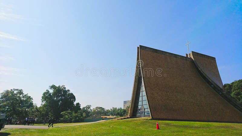 Side View of the Luce Chapel with Grass in the Front Under a Clear Sky ...