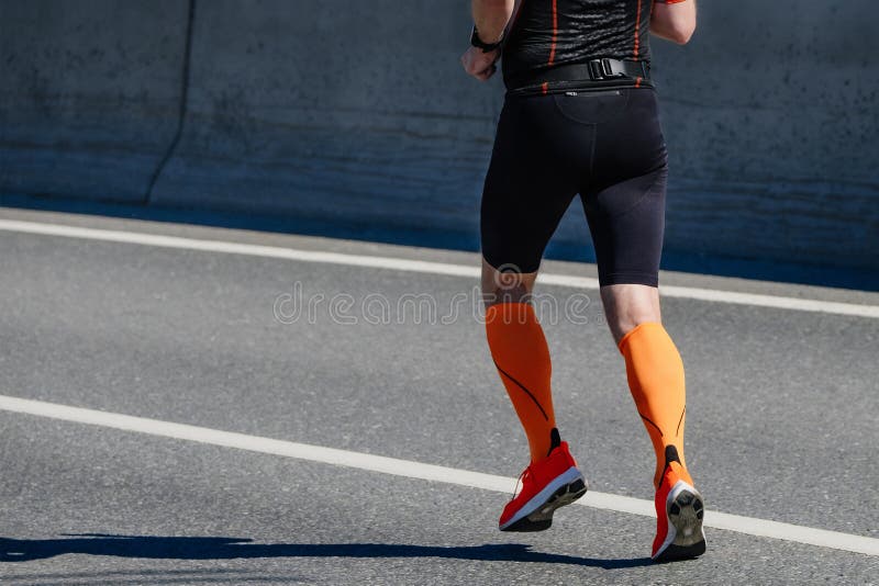 Side View Male Athlete in Compression Socks Running Marathon Race on ...