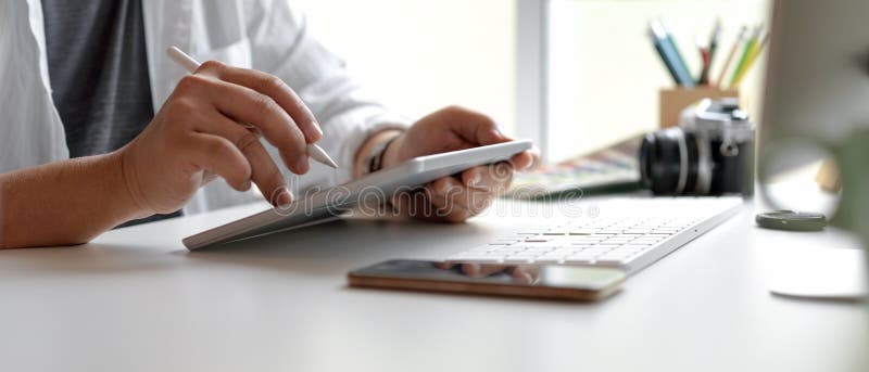 Male Designer Using Digital Tablet with Stylus Pen on White Office Desk ...