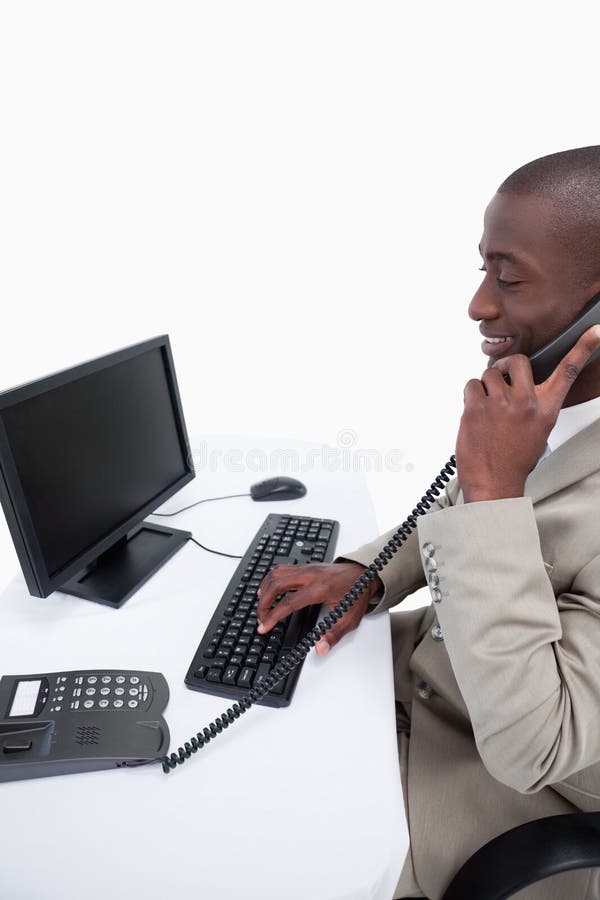 Man Using Laptop and Talking on Phone in Kitchen at Home Stock Image ...