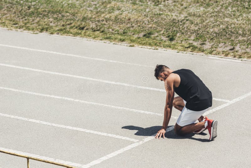 Side View of Male Sprinter in Starting Position on Running Stock Image ...