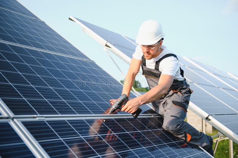 Side View of Male Worker Installing Solar Modules and Support ...