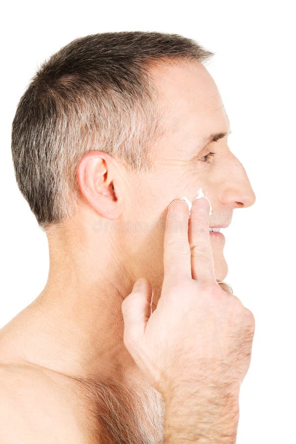 Side View of a Man Applying Cream on His Face Stock Image - Image of ...