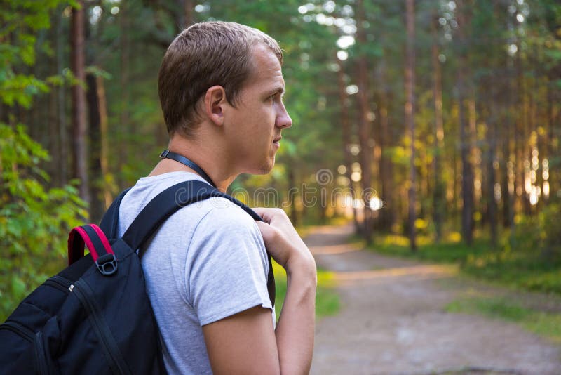 Side View of Man with Backpack Hiking in Forest Stock Photo - Image of ...